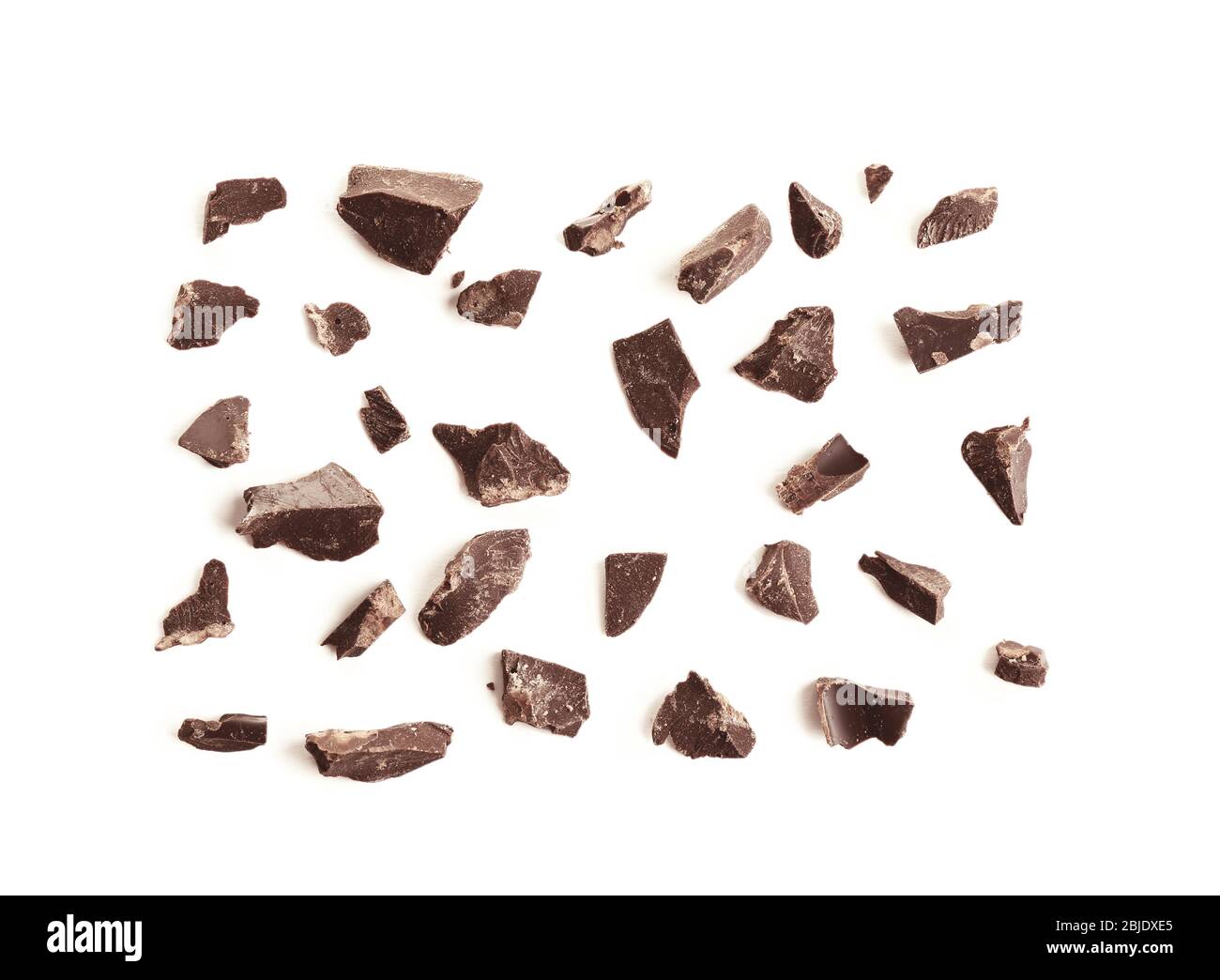 Dark chocolate morsels on white background Stock Photo - Alamy