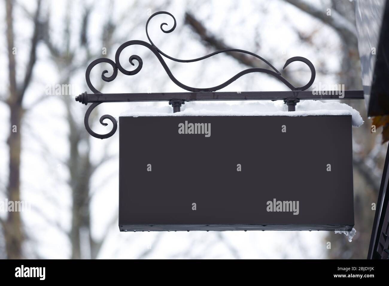 Signboard hanging on building outdoors Stock Photo - Alamy