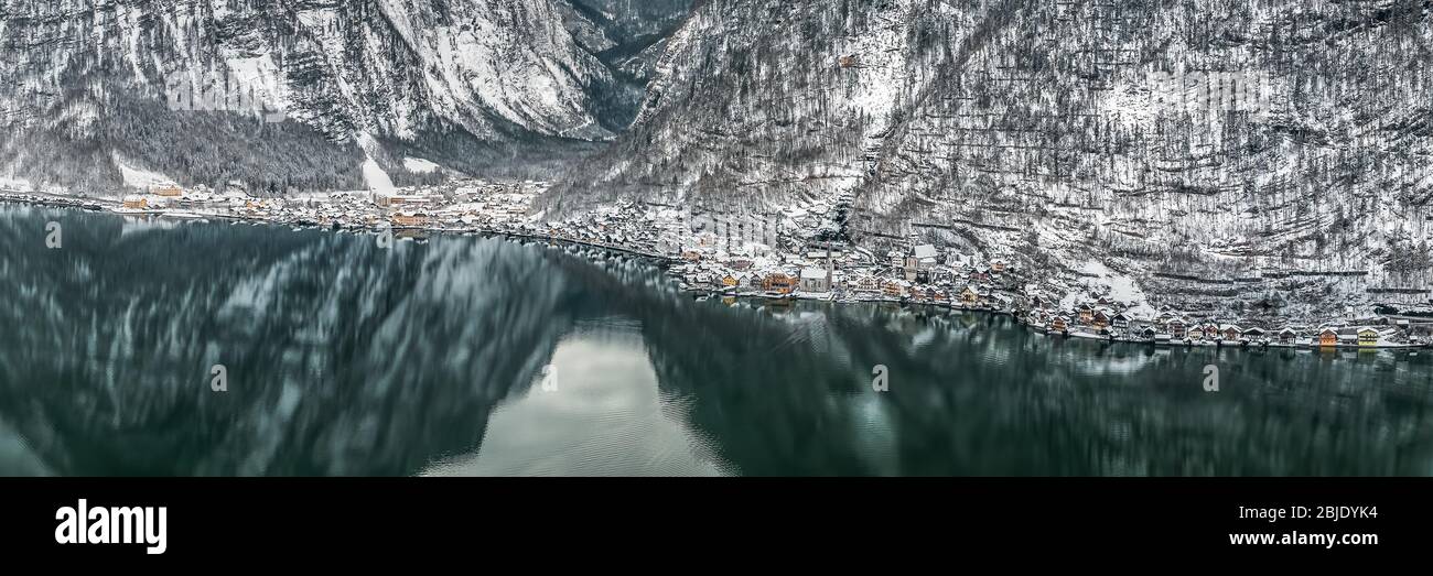 Aerial panoramic drone shot of Hallstatt and Lahn village by lake at ...