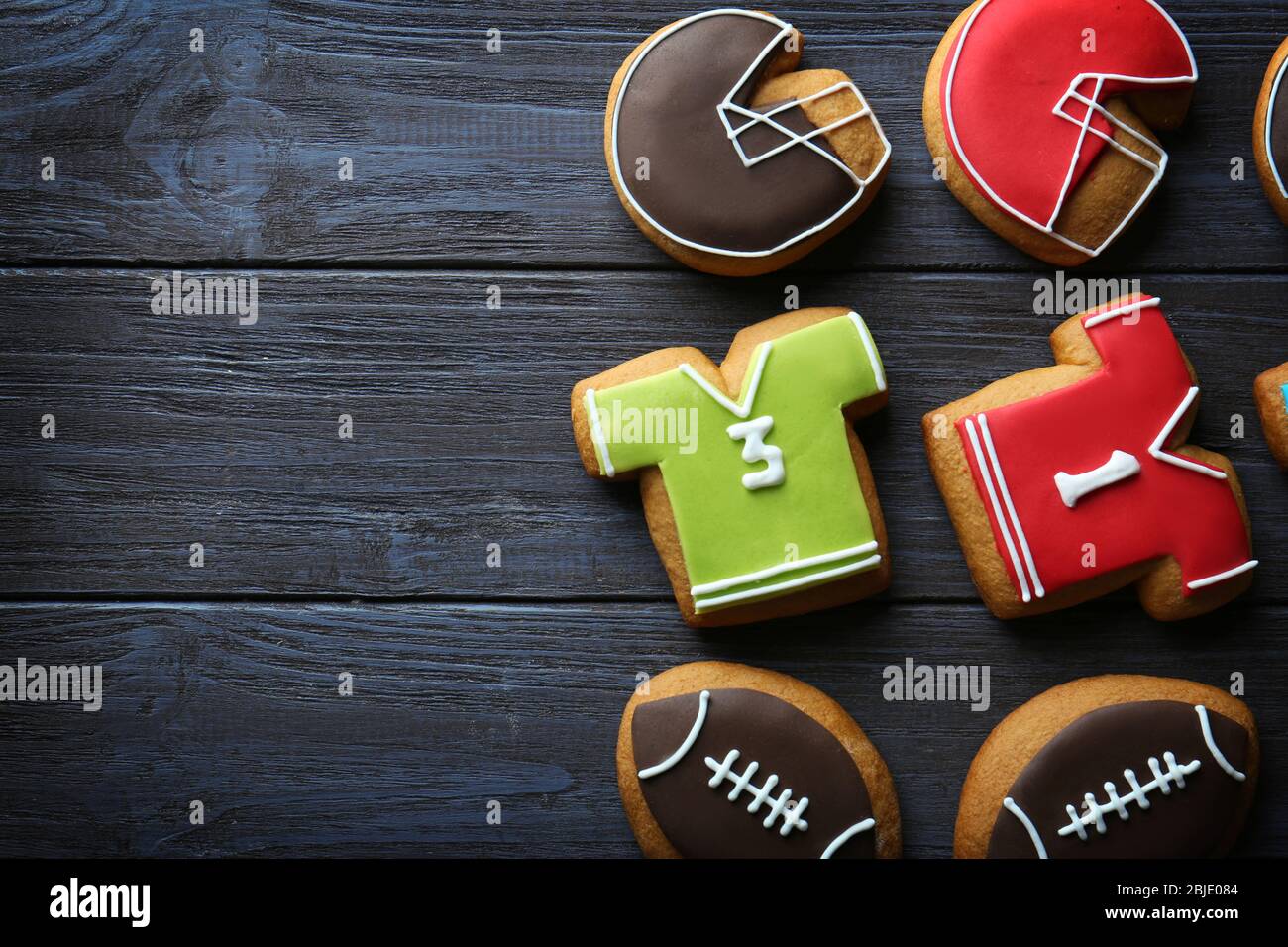 Tasty football cookies on wooden background Stock Photo - Alamy