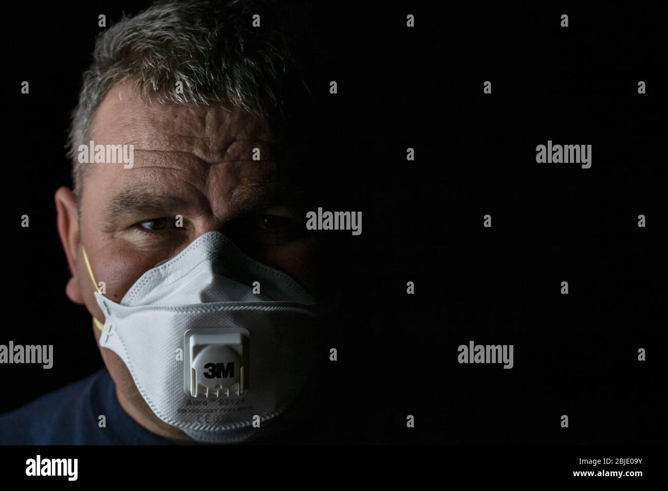 Man with protective 3M medical mask. 3M Aura 9312. The face mask used ...
