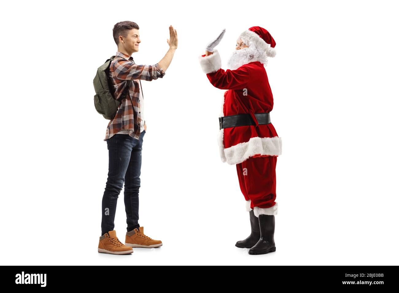 Full length profile shot of a male student making high-five gesture ...