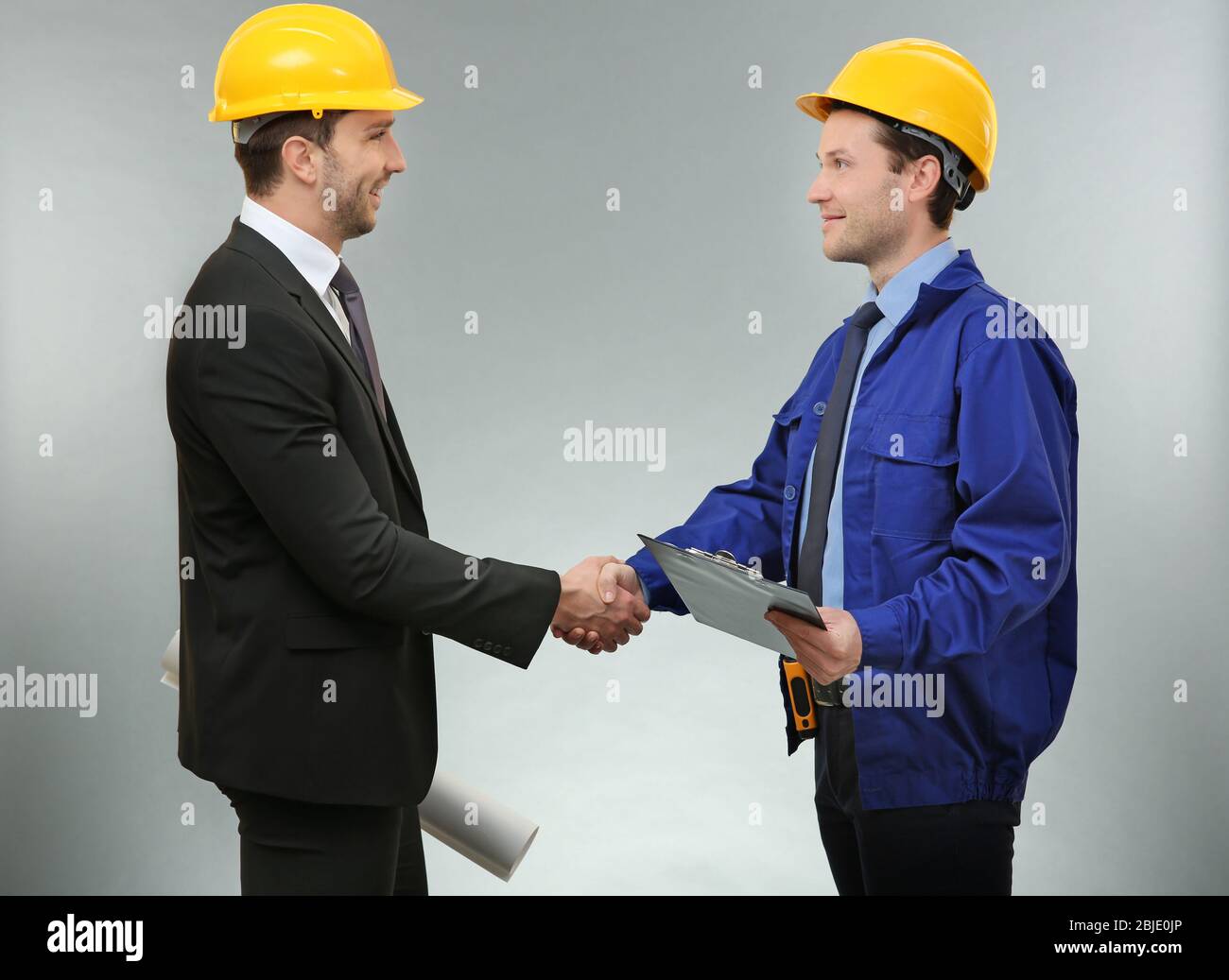 Male architect foreman shaking hands hi-res stock photography and ...