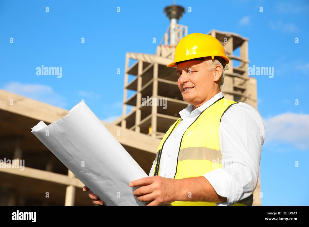 Senior architect drawing building plan hi-res stock photography and ...