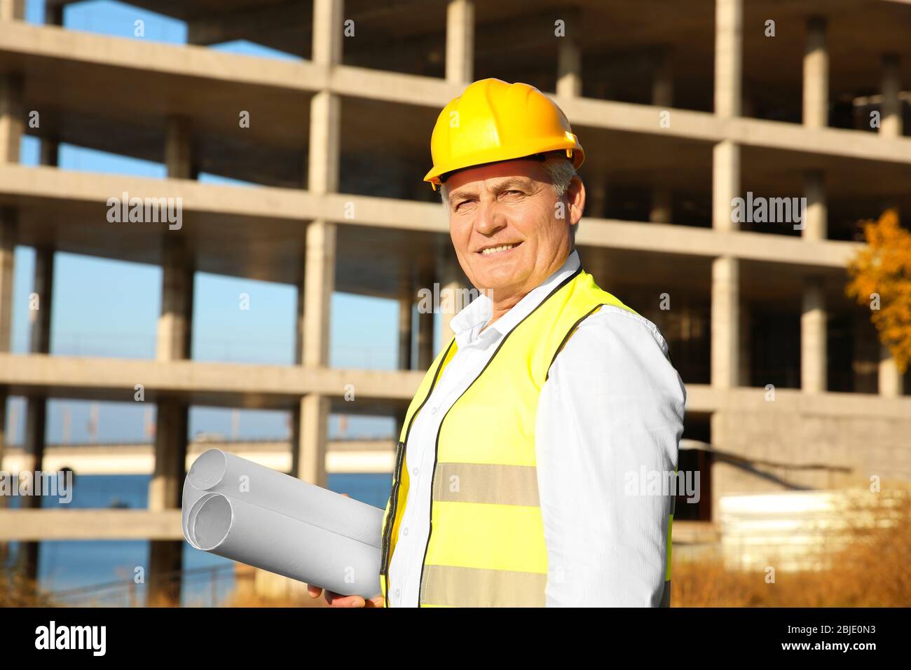 Senior architect drawing building plan hi-res stock photography and ...