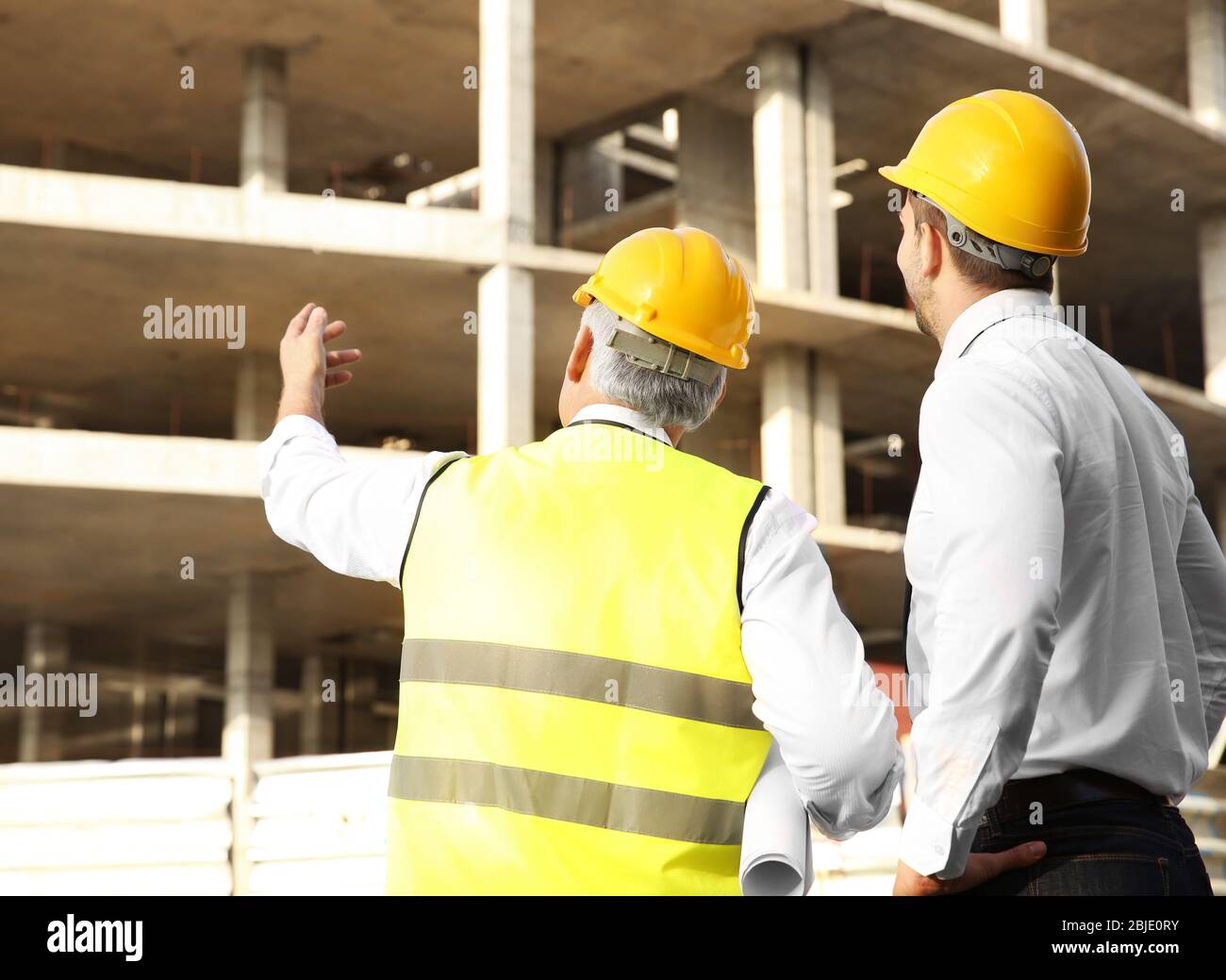 Architect engineer discussing plan build hi-res stock photography and ...