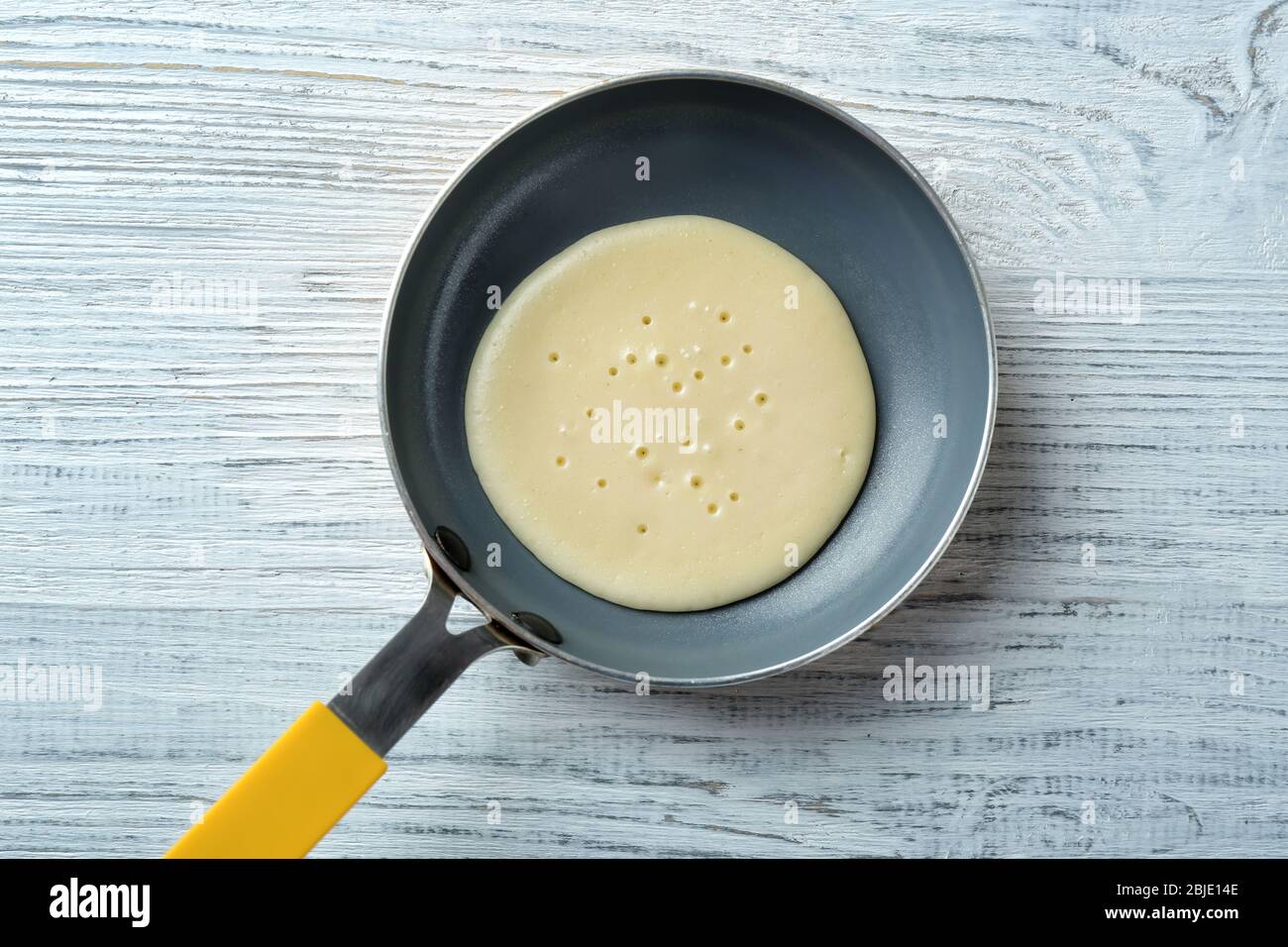 Preparation of pancakes on pan, top view Stock Photo - Alamy