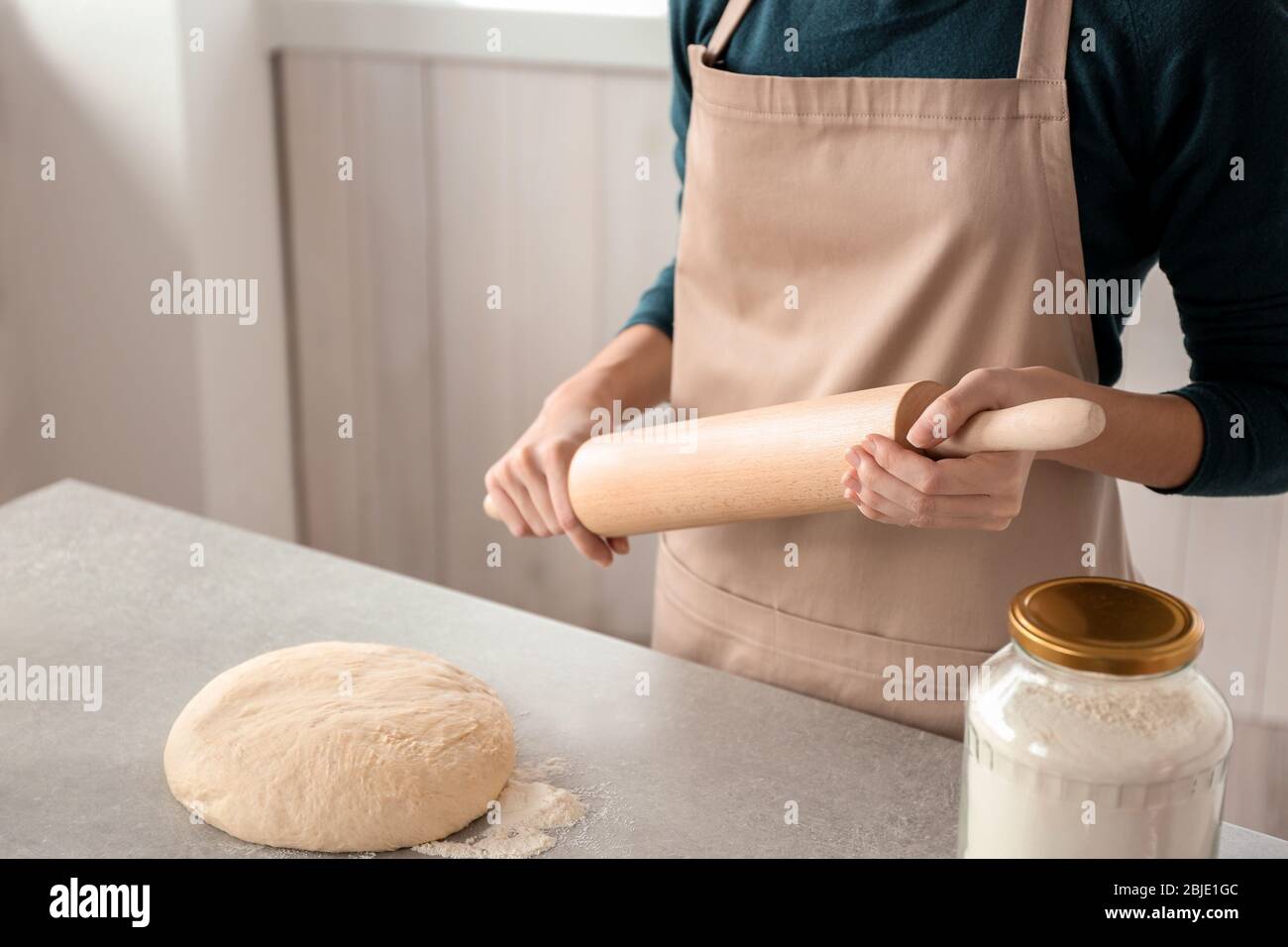 Woman holding rolling pin hi-res stock photography and images - Alamy