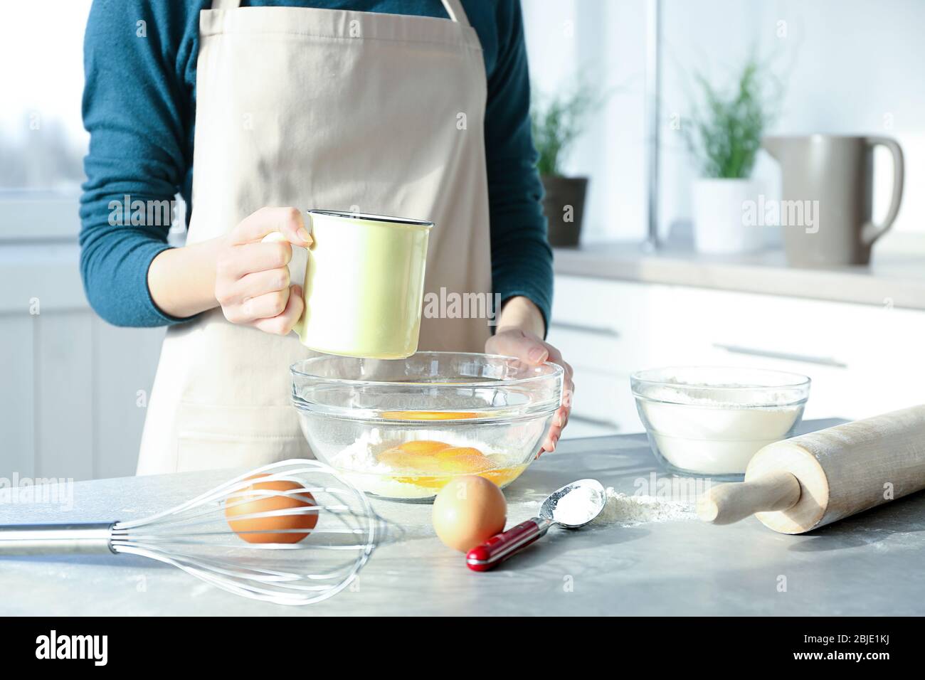 Milk pouring in bowl dough hi-res stock photography and images - Alamy