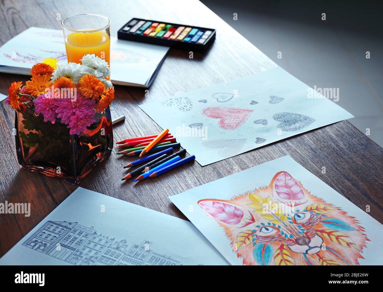 Coloring pictures for adults on table Stock Photo - Alamy