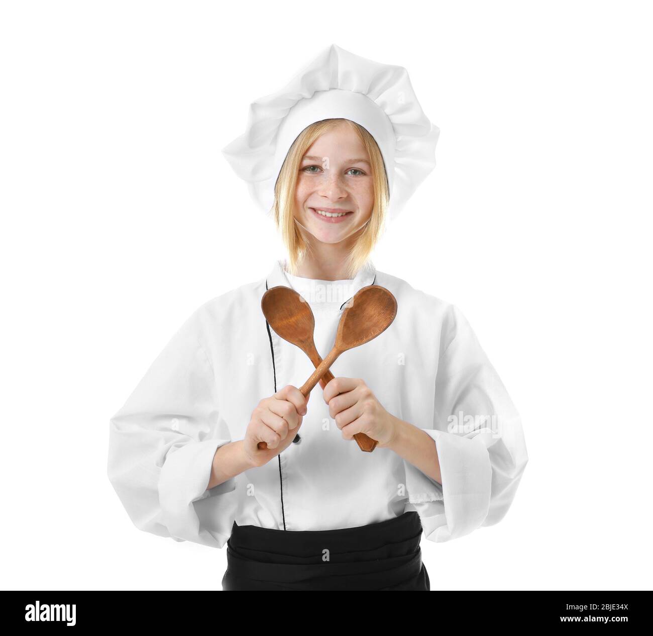 Cute girl in chef uniform on white background Stock Photo - Alamy