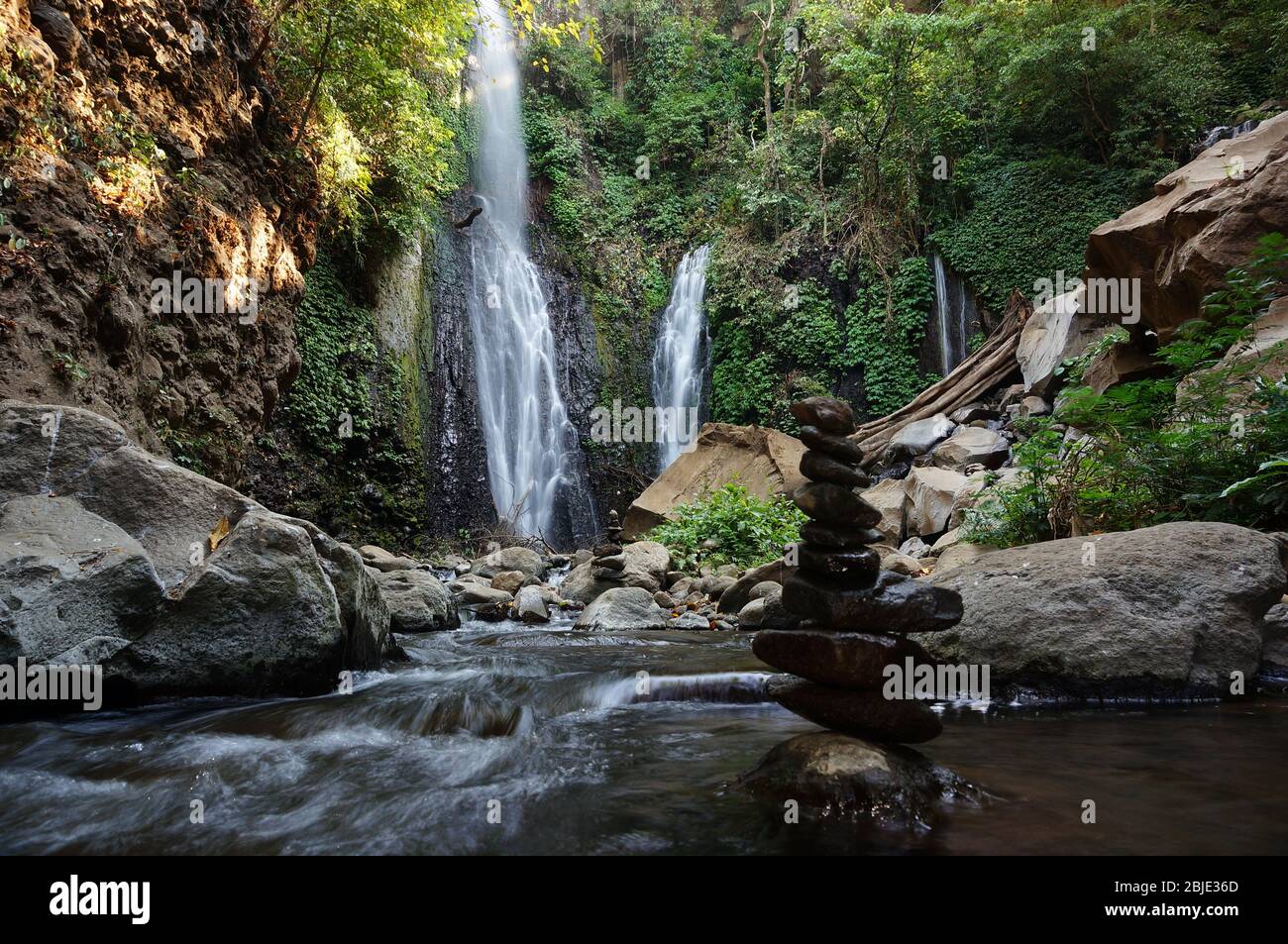 Waterfall is a beautiful place to visit with water coming from mountain ...