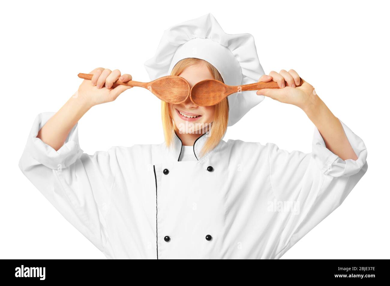 Cute girl in chef uniform on white background Stock Photo - Alamy