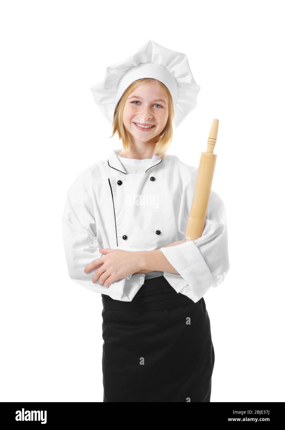 Cute girl in chef uniform on white background Stock Photo - Alamy