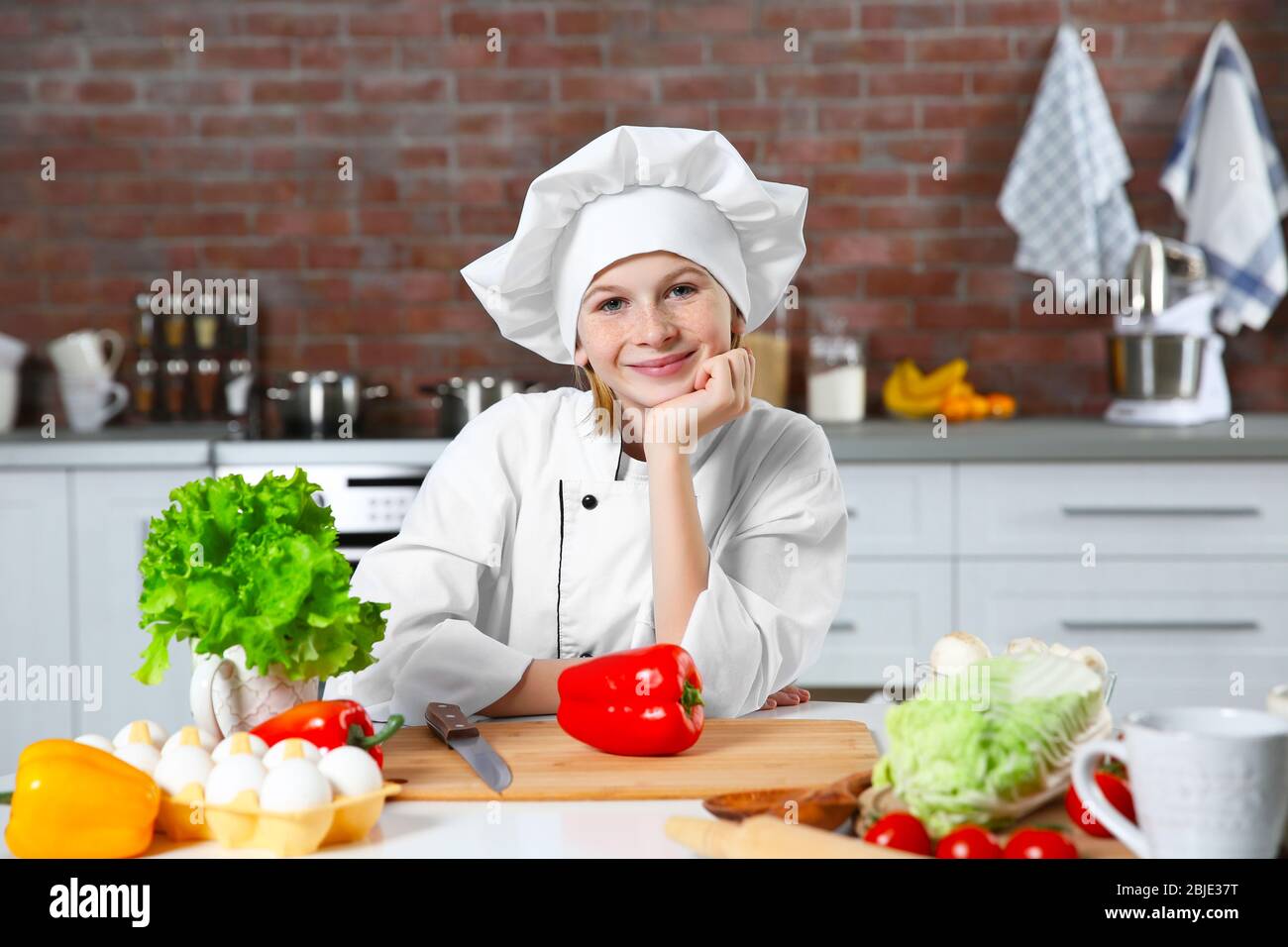 Cute girl cooking in kitchen at home Stock Photo - Alamy