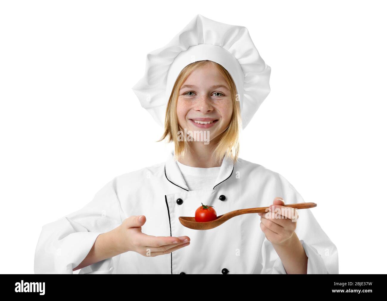 Cute girl in chef uniform on white background Stock Photo - Alamy