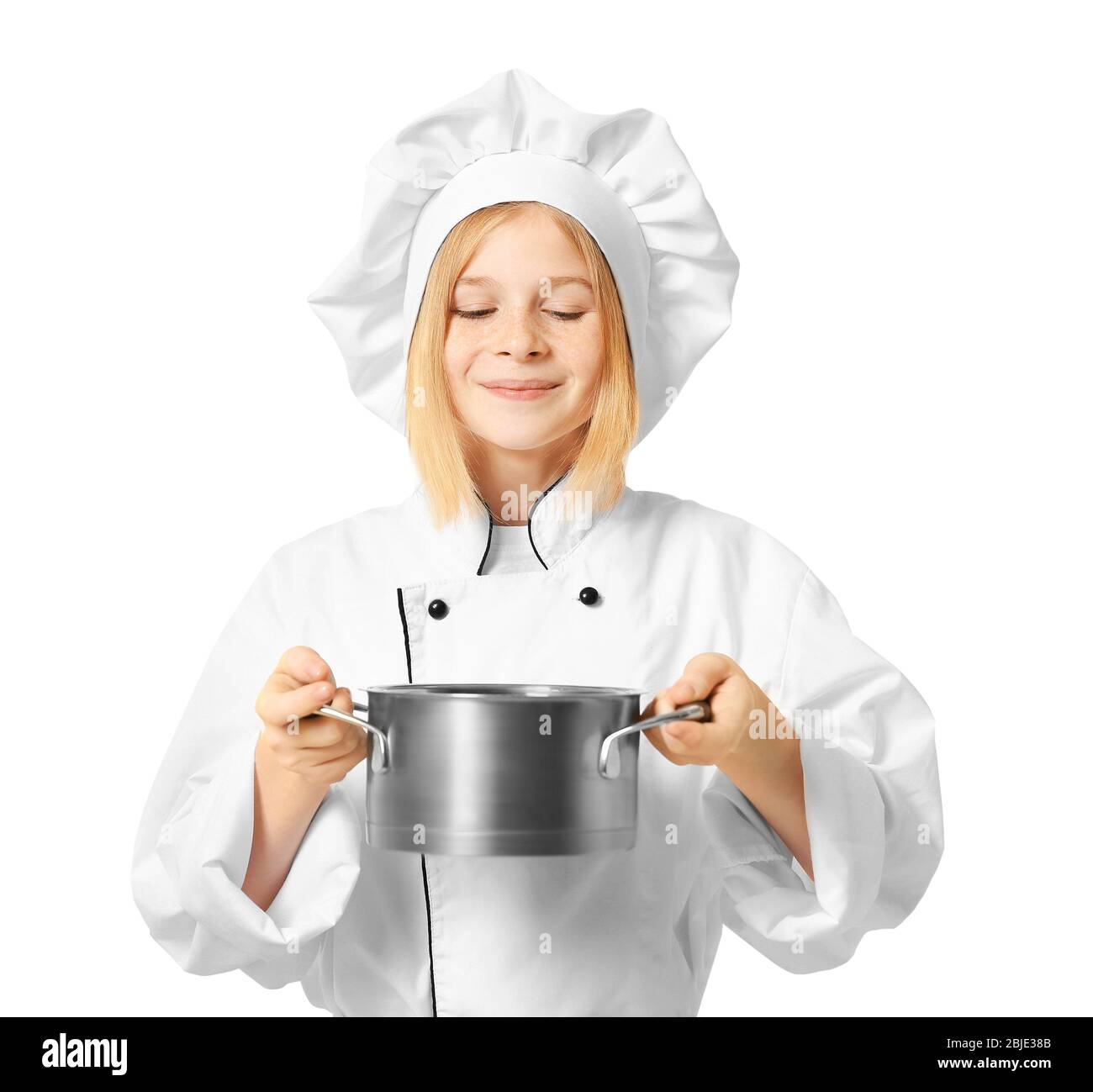 Cute girl in chef uniform on white background Stock Photo - Alamy