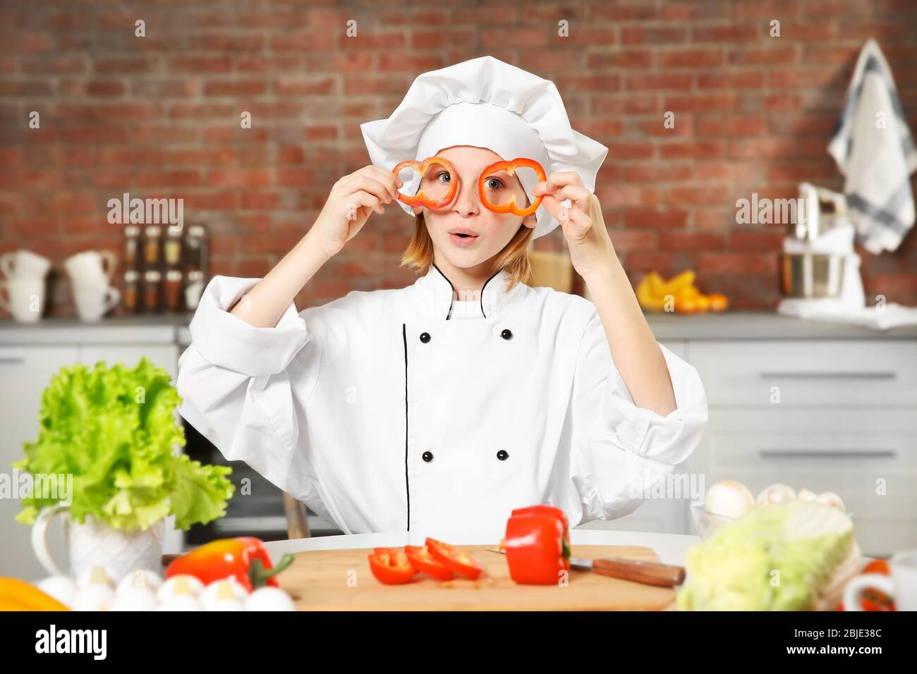 Cute girl cooking in kitchen at home Stock Photo - Alamy