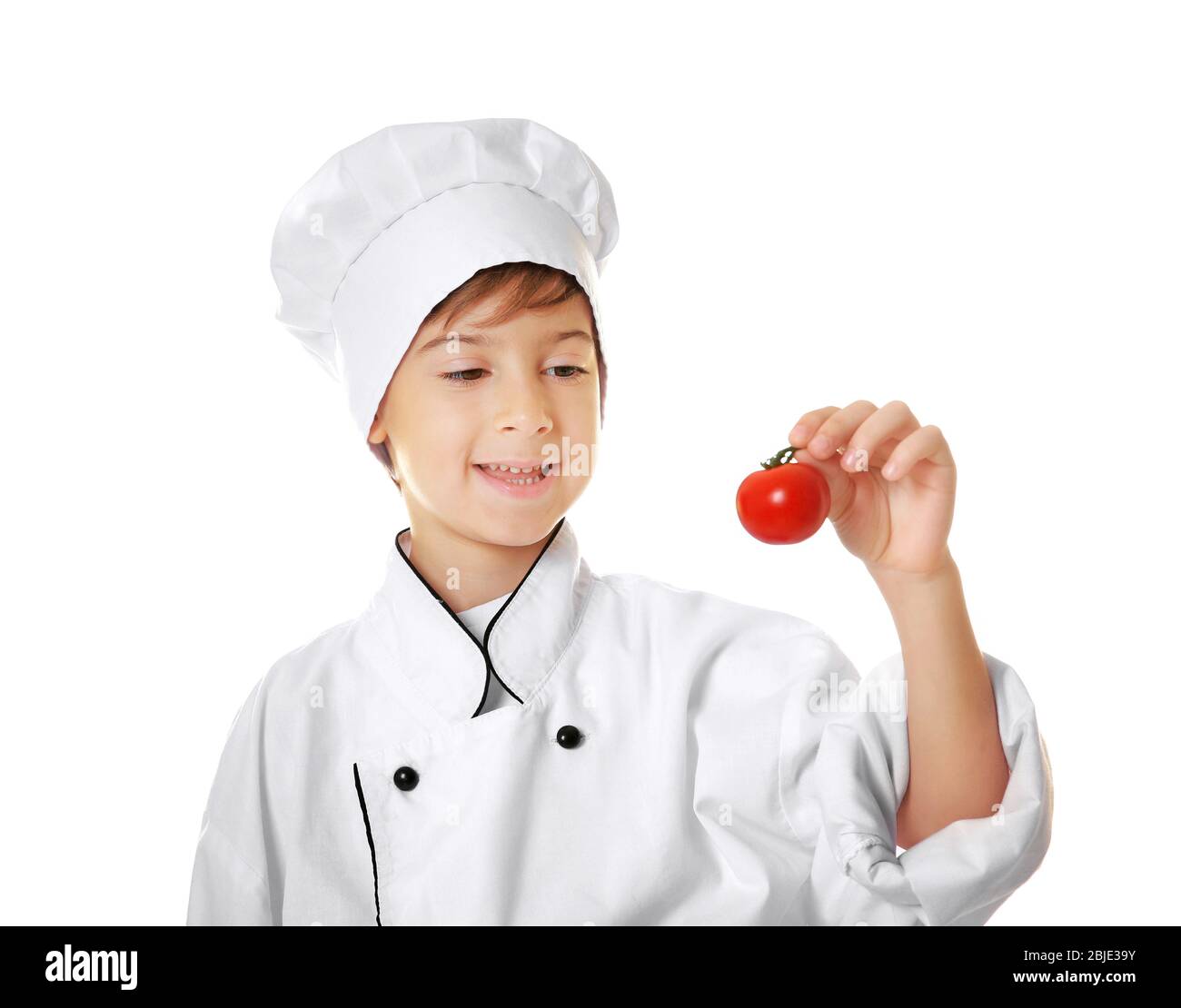 Cute boy in chef uniform on white background Stock Photo - Alamy