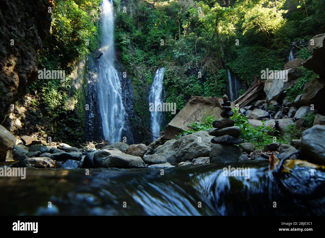 Waterfall is a beautiful place to visit with water coming from mountain ...