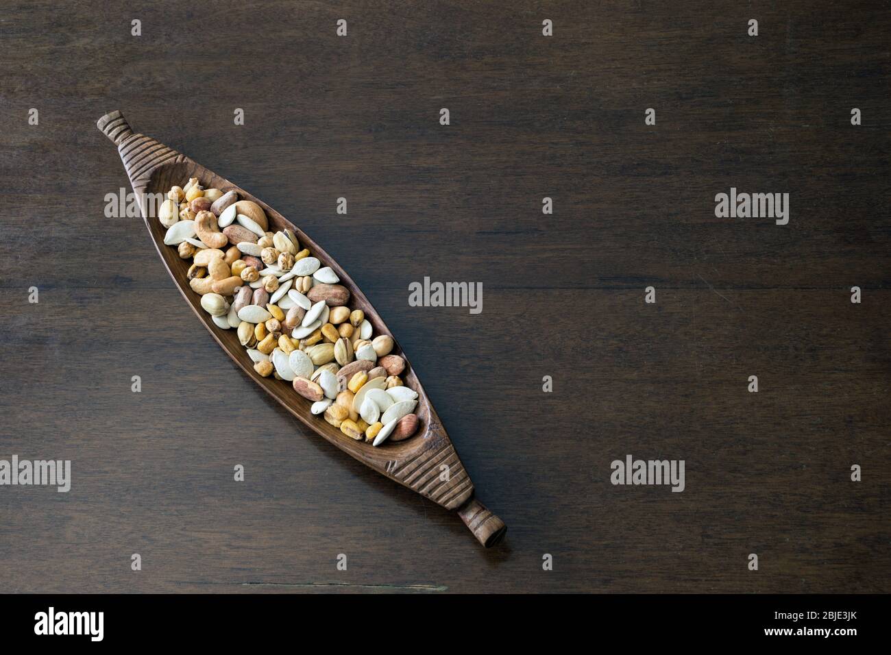Roasted and salty, mixed nuts and kernels snack Stock Photo - Alamy