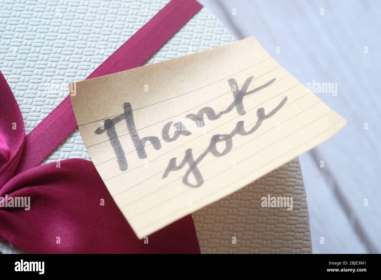 White Sticky Note With Thank You message on gift Stock Photo - Alamy
