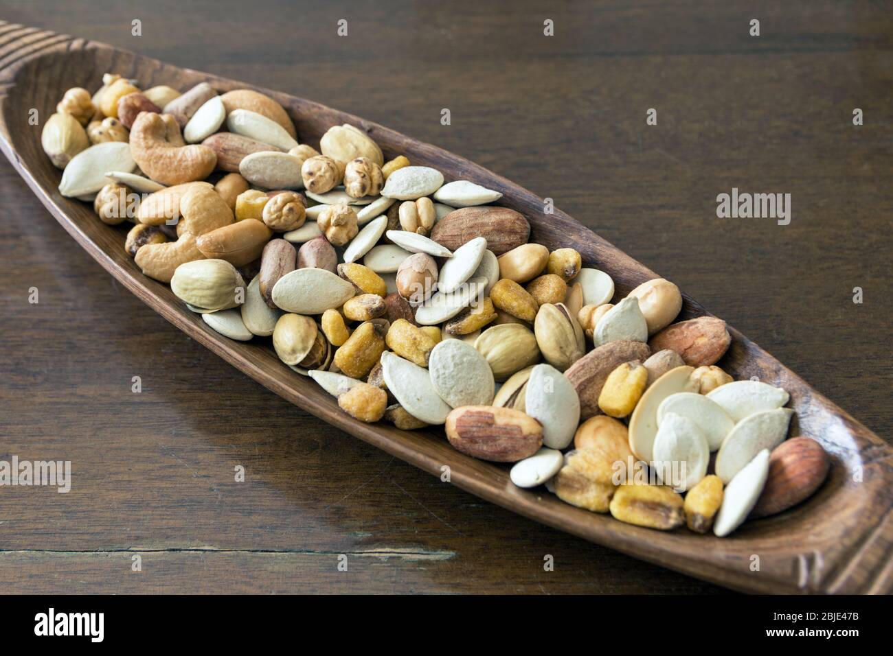 Roasted and salty, mixed nuts and kernels snack Stock Photo - Alamy