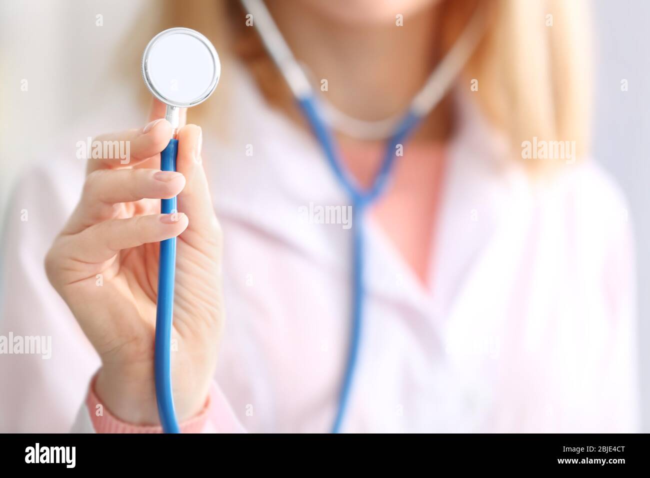 Doctor with stethoscope, closeup Stock Photo - Alamy
