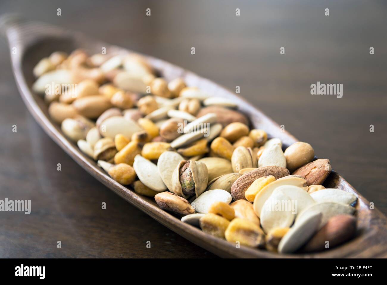 Roasted and salty, mixed nuts and kernels snack Stock Photo - Alamy