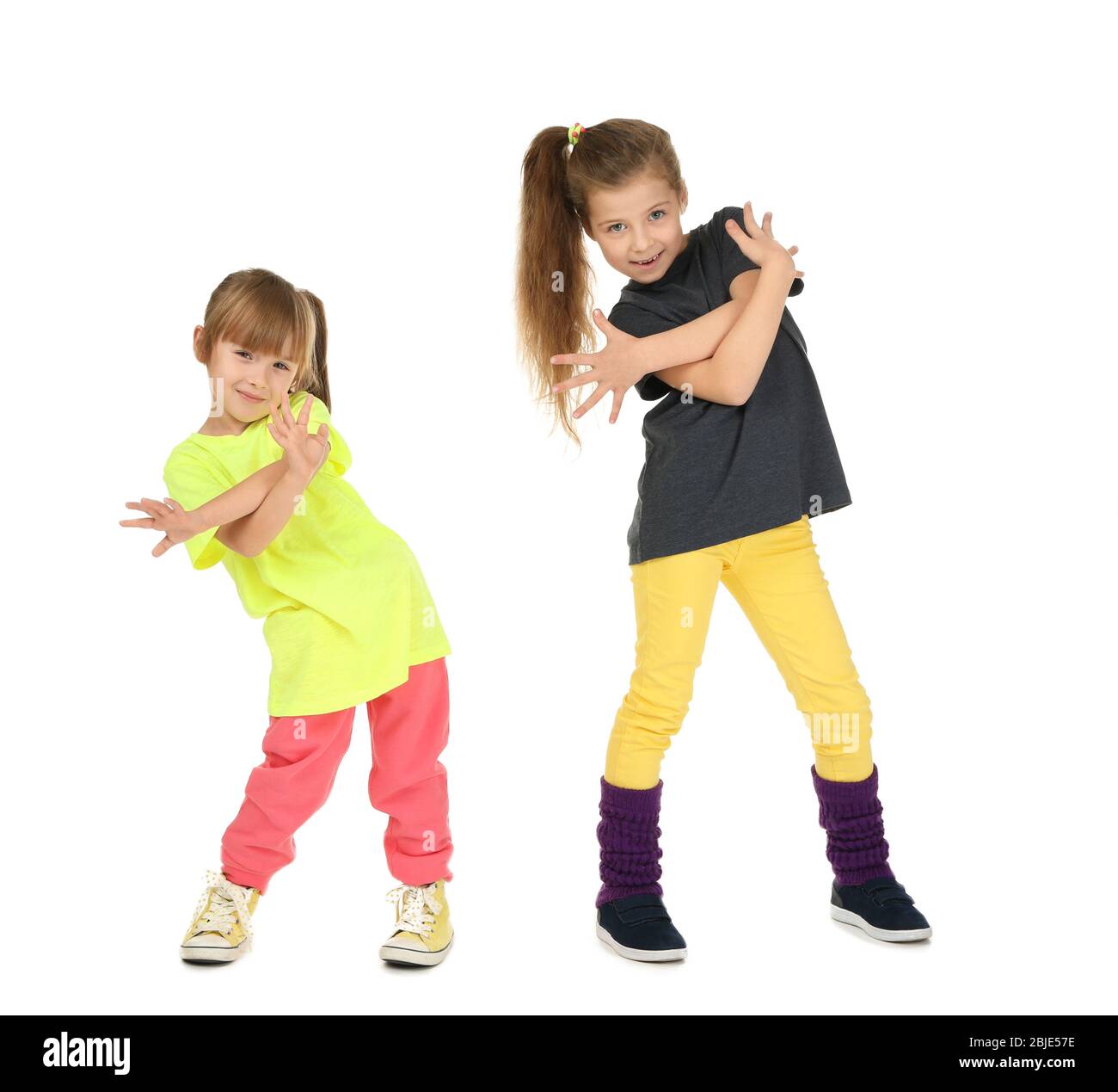 Cute funny girls dancing on white background Stock Photo - Alamy