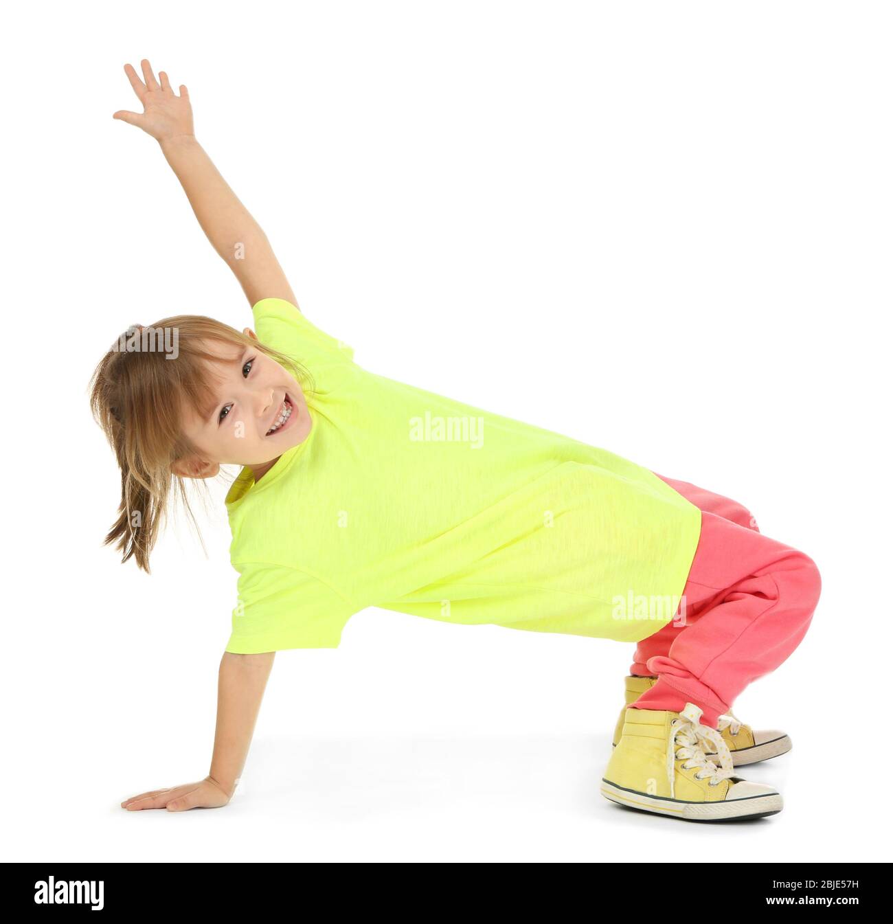 Cute funny girl dancing on white background Stock Photo - Alamy
