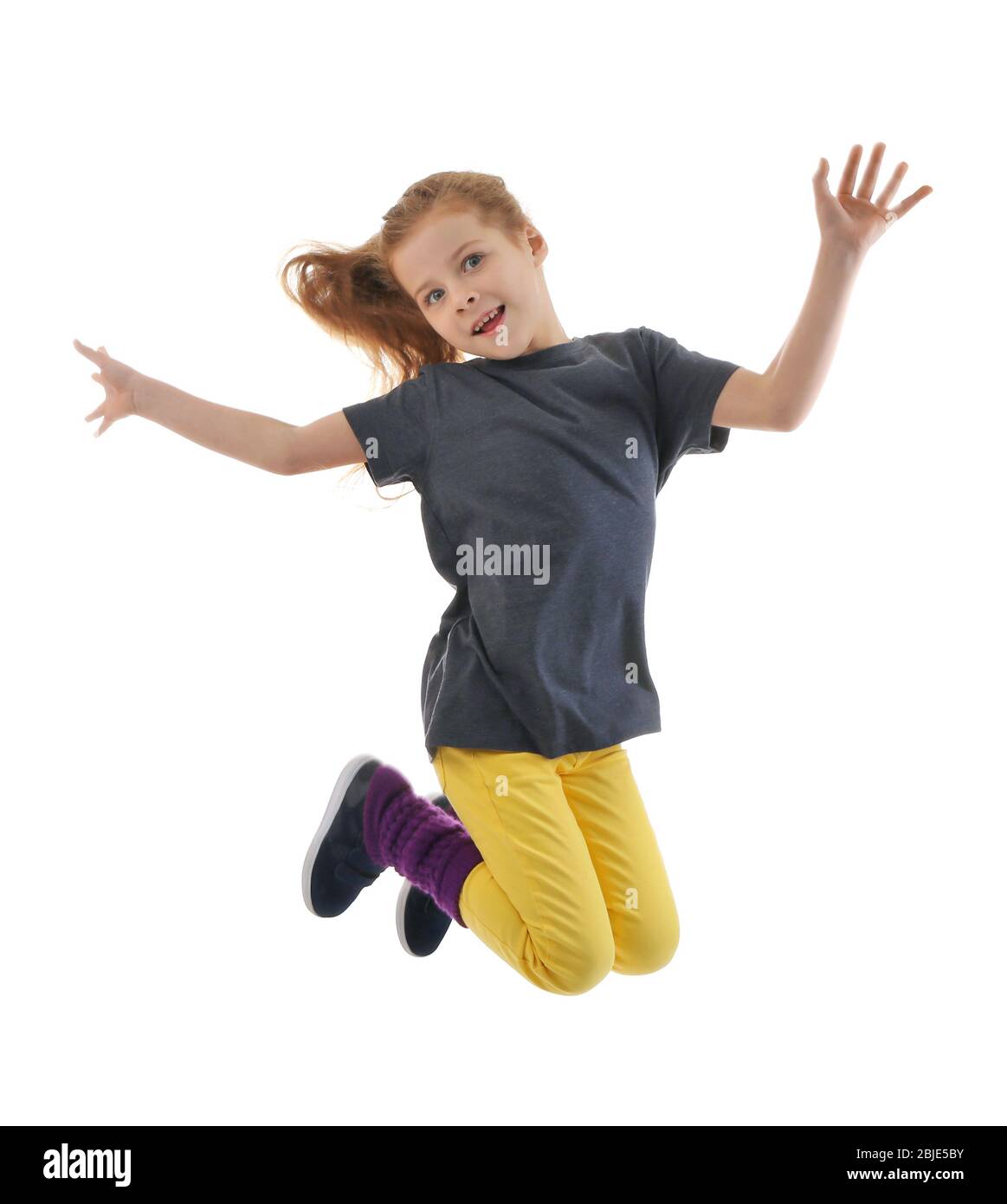 Cute funny girl jumping on white background Stock Photo - Alamy