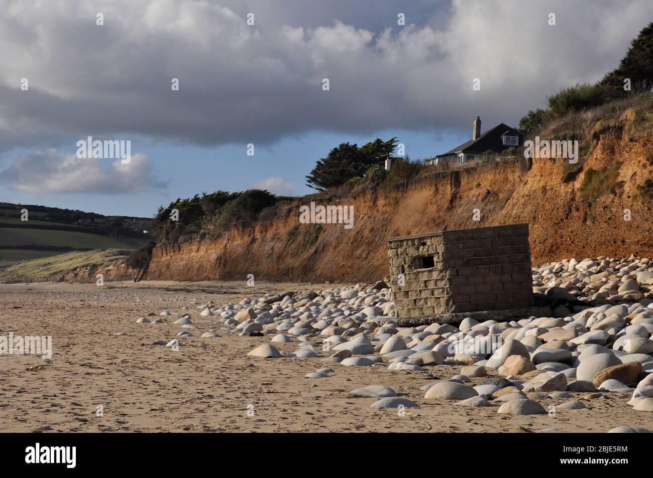 WW2 pill box, built on a the cliff at Praa Sands as part of coast ...