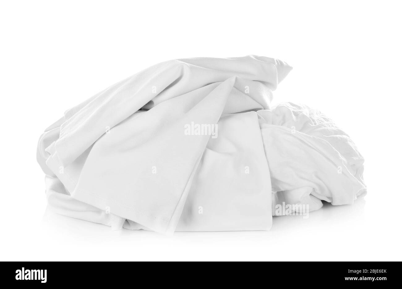 Pile of clothes on white background Stock Photo - Alamy