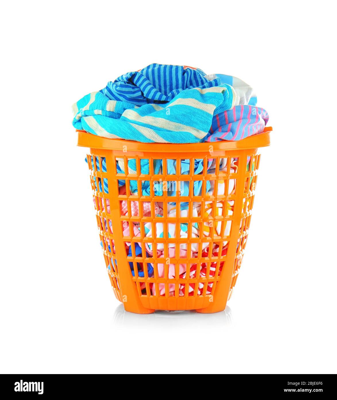Clothes in basket on white background Stock Photo - Alamy