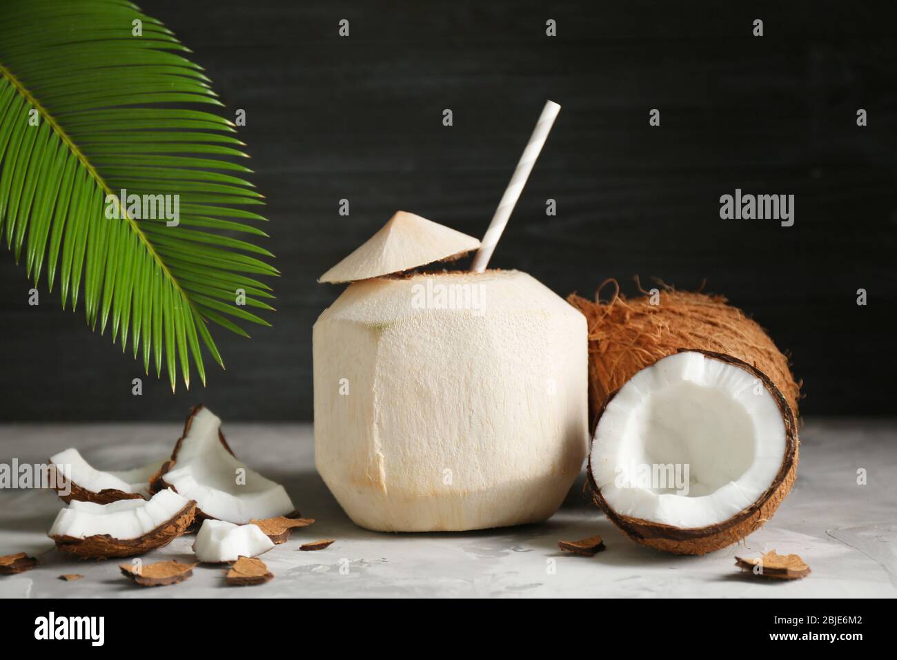 Fresh coconut cocktail on dark background Stock Photo - Alamy