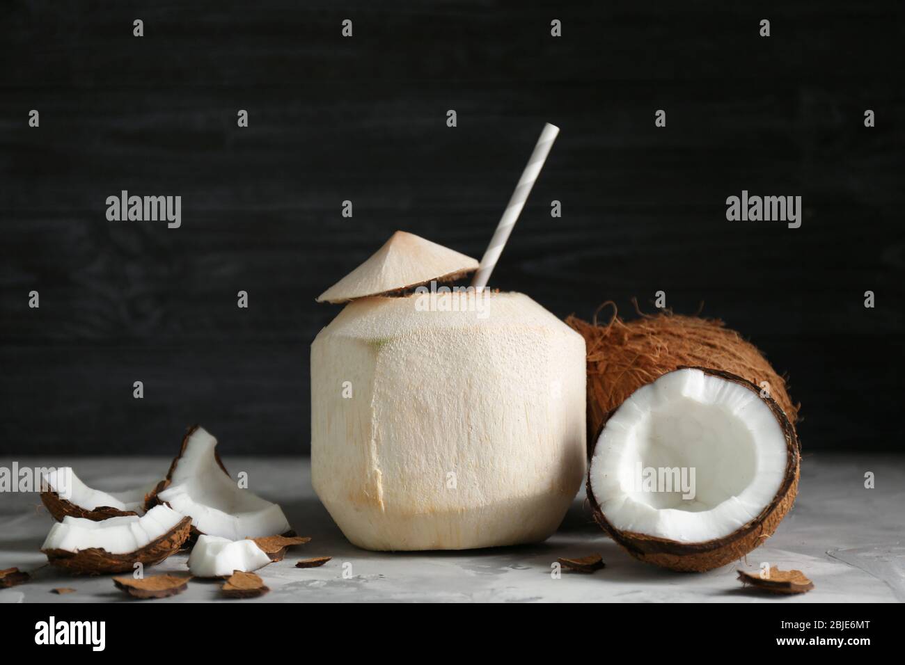 Fresh coconut cocktail on dark background Stock Photo - Alamy