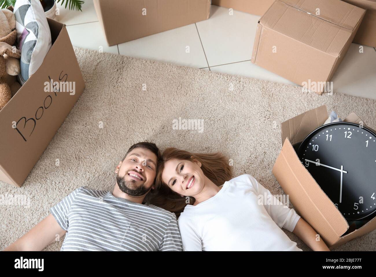 Cardboard box books clock hi-res stock photography and images - Alamy