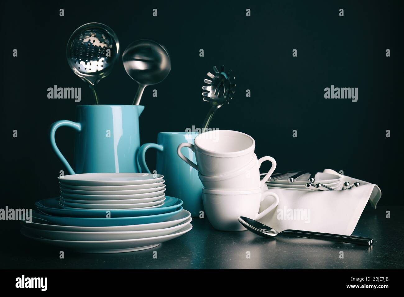 Set of dinnerware on black background Stock Photo - Alamy