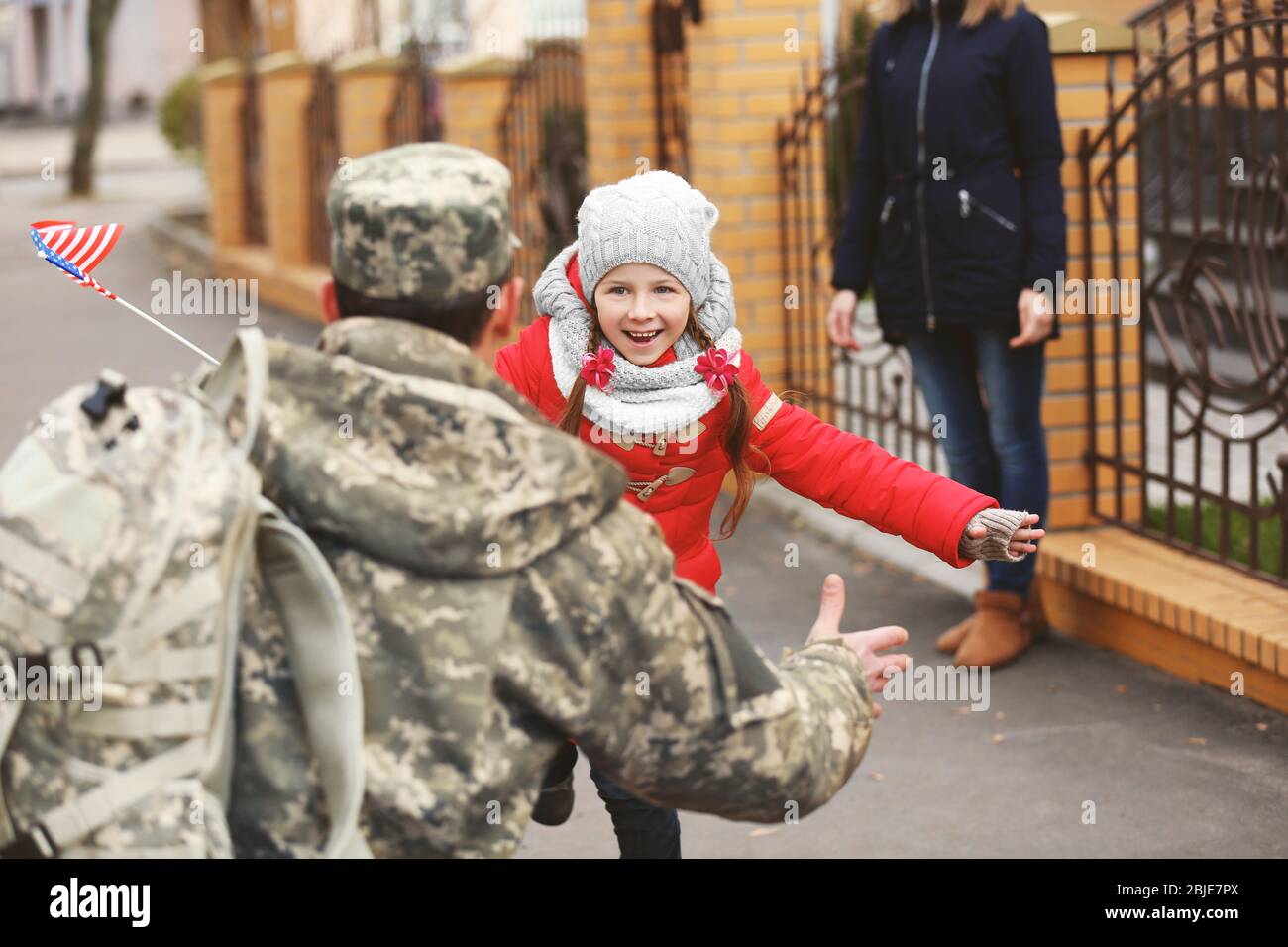 Happy reunion of soldier with family outdoors Stock Photo - Alamy