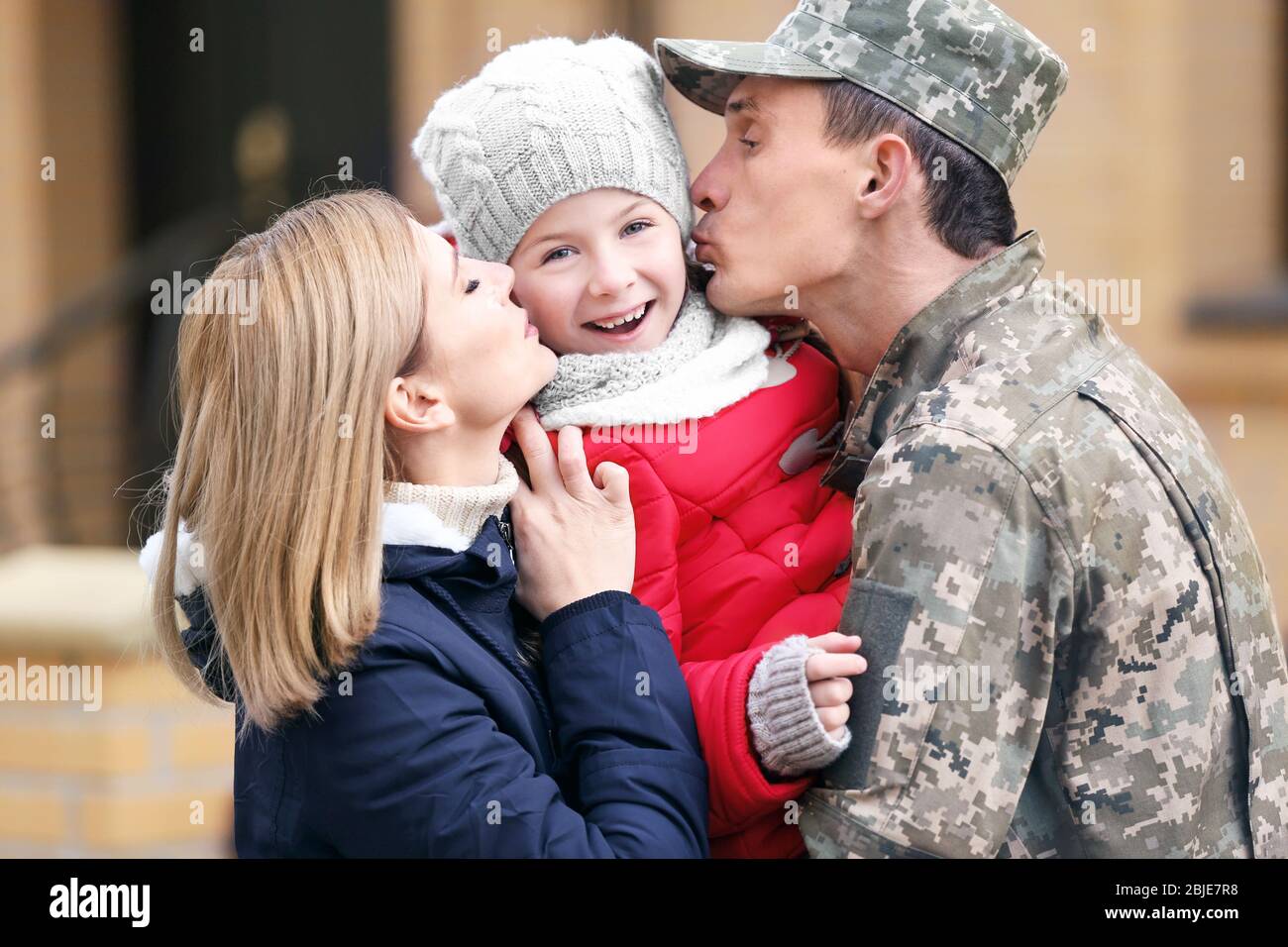 Happy soldier with his family outdoors Stock Photo - Alamy