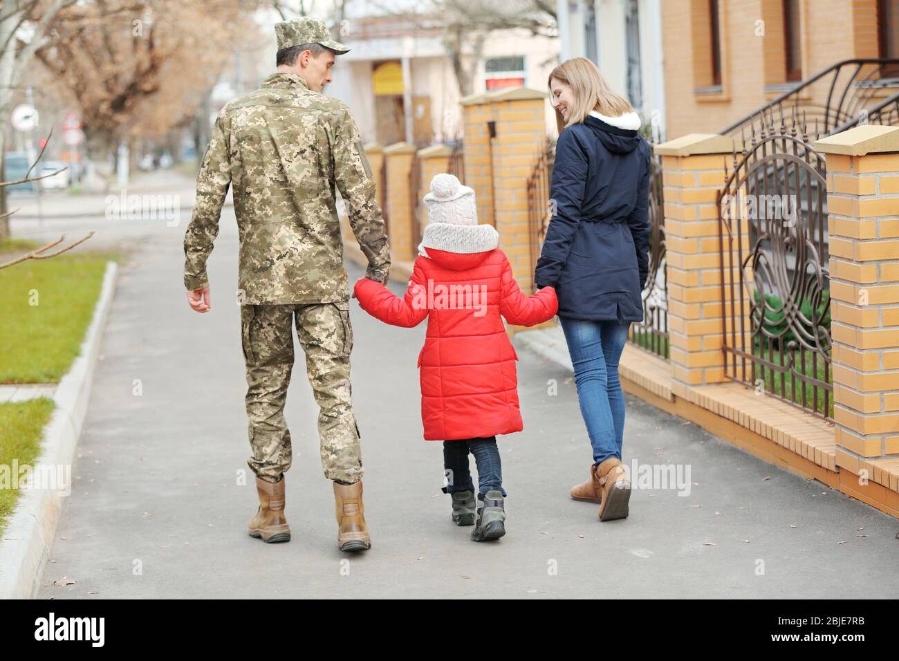 Happy soldier with family outdoors Stock Photo - Alamy