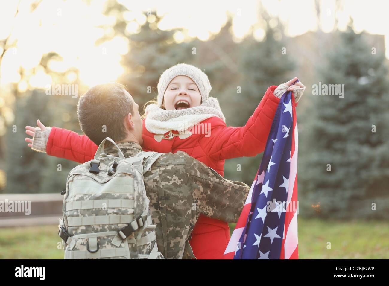 USA soldier hugging his daughter outdoors Stock Photo - Alamy