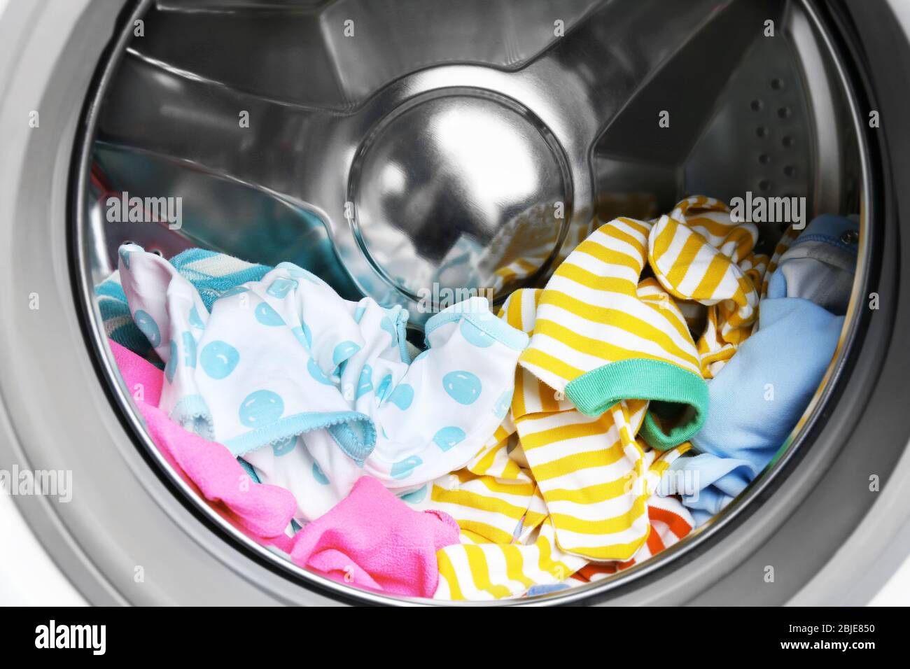 Clothes in washing machine, close up Stock Photo - Alamy