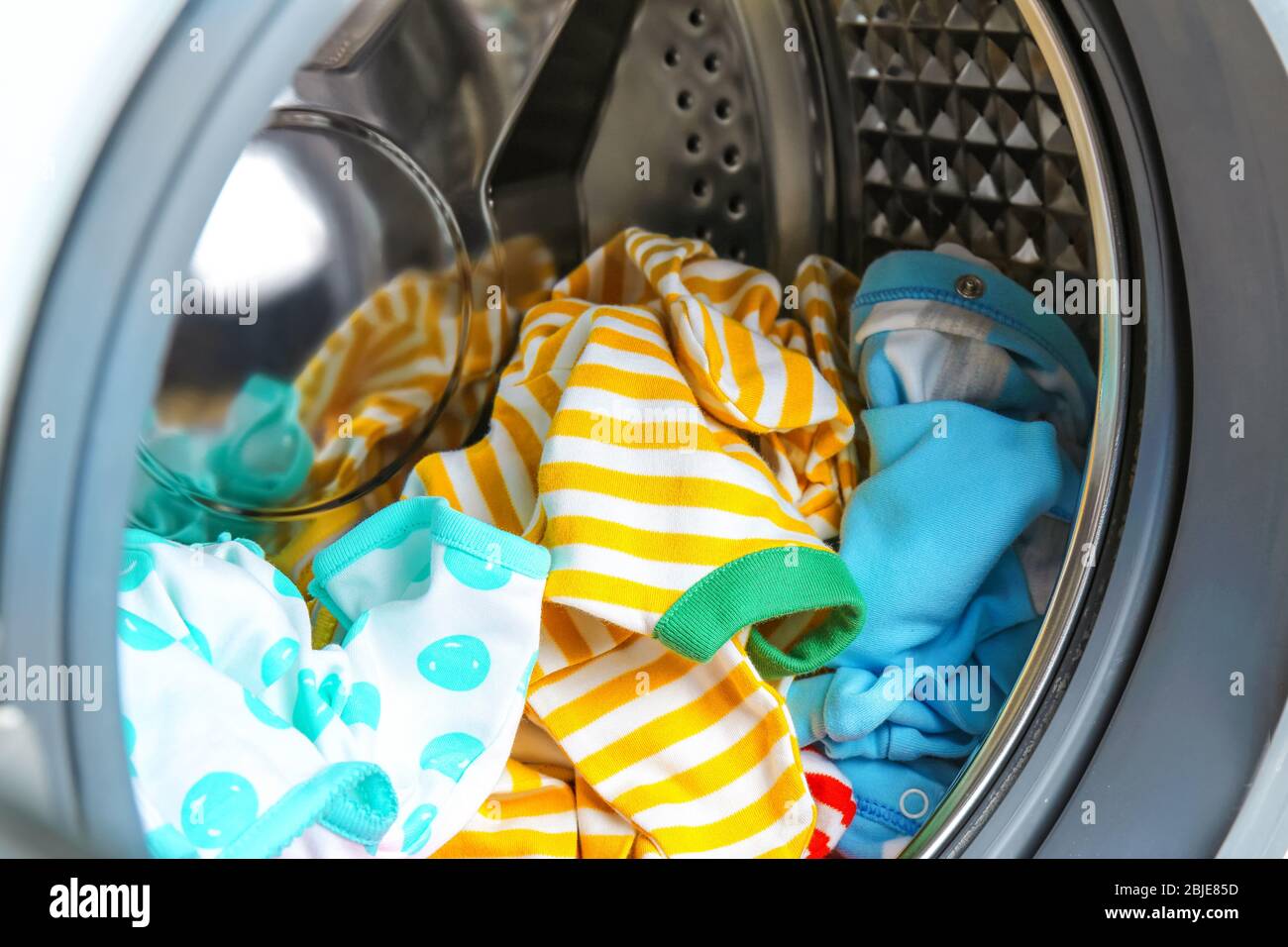 Clothes in washing machine, close up Stock Photo - Alamy
