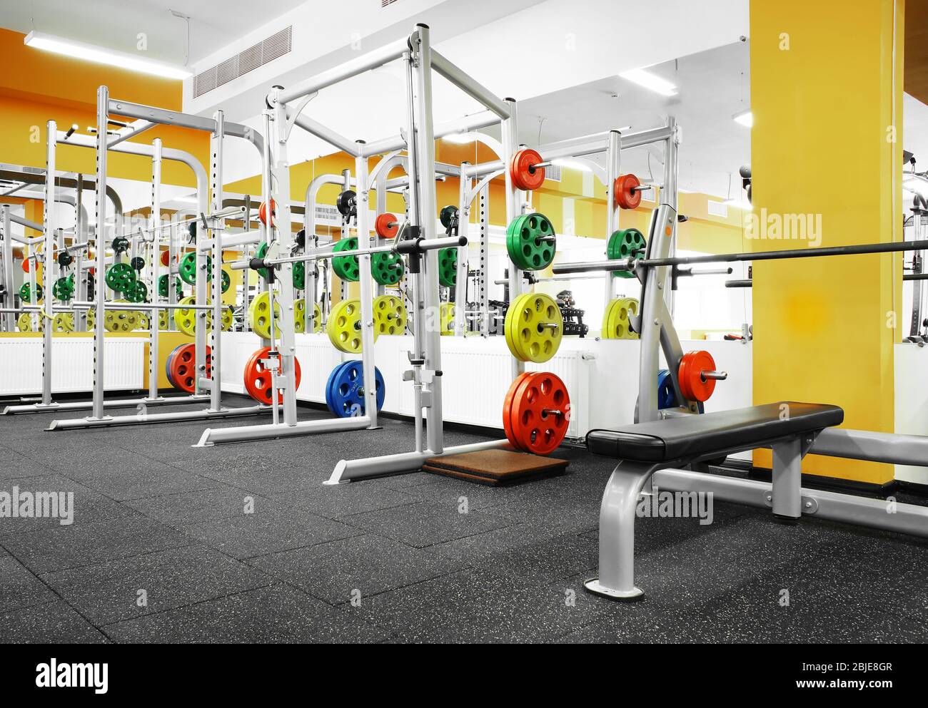 Exercise equipment in modern gym Stock Photo - Alamy