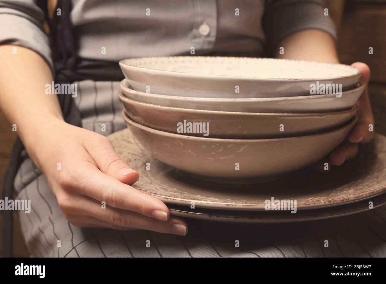 Hands holding bowls hi-res stock photography and images - Alamy