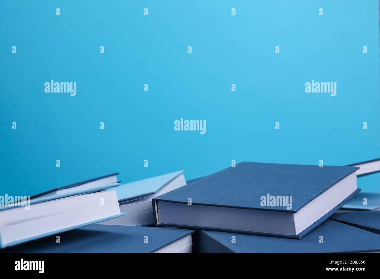 Books on blue background Stock Photo - Alamy