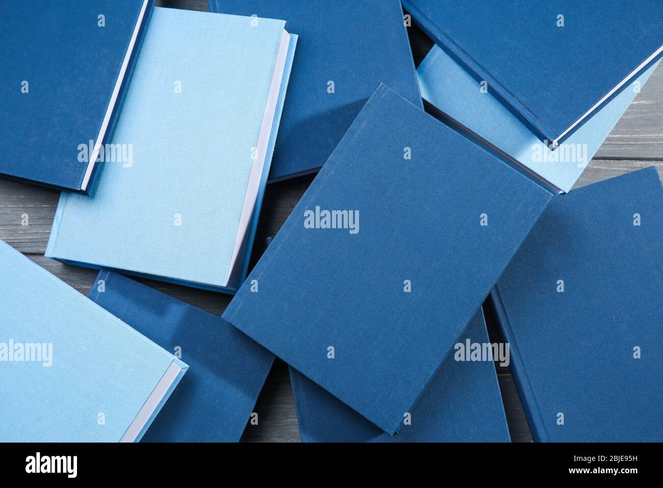 Blue hardcover books background Stock Photo - Alamy