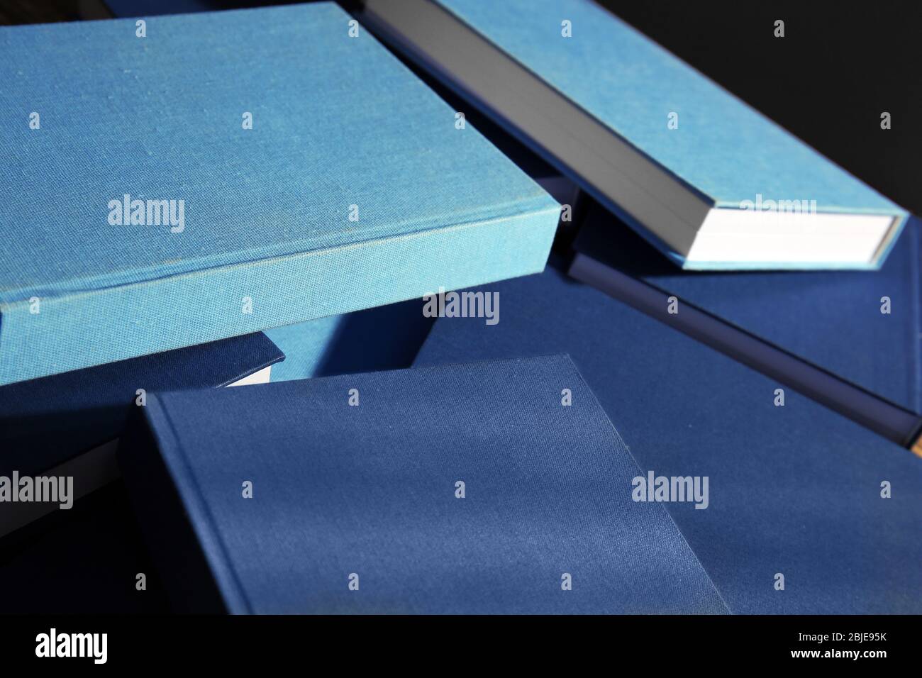 Blue hardcover books background Stock Photo - Alamy